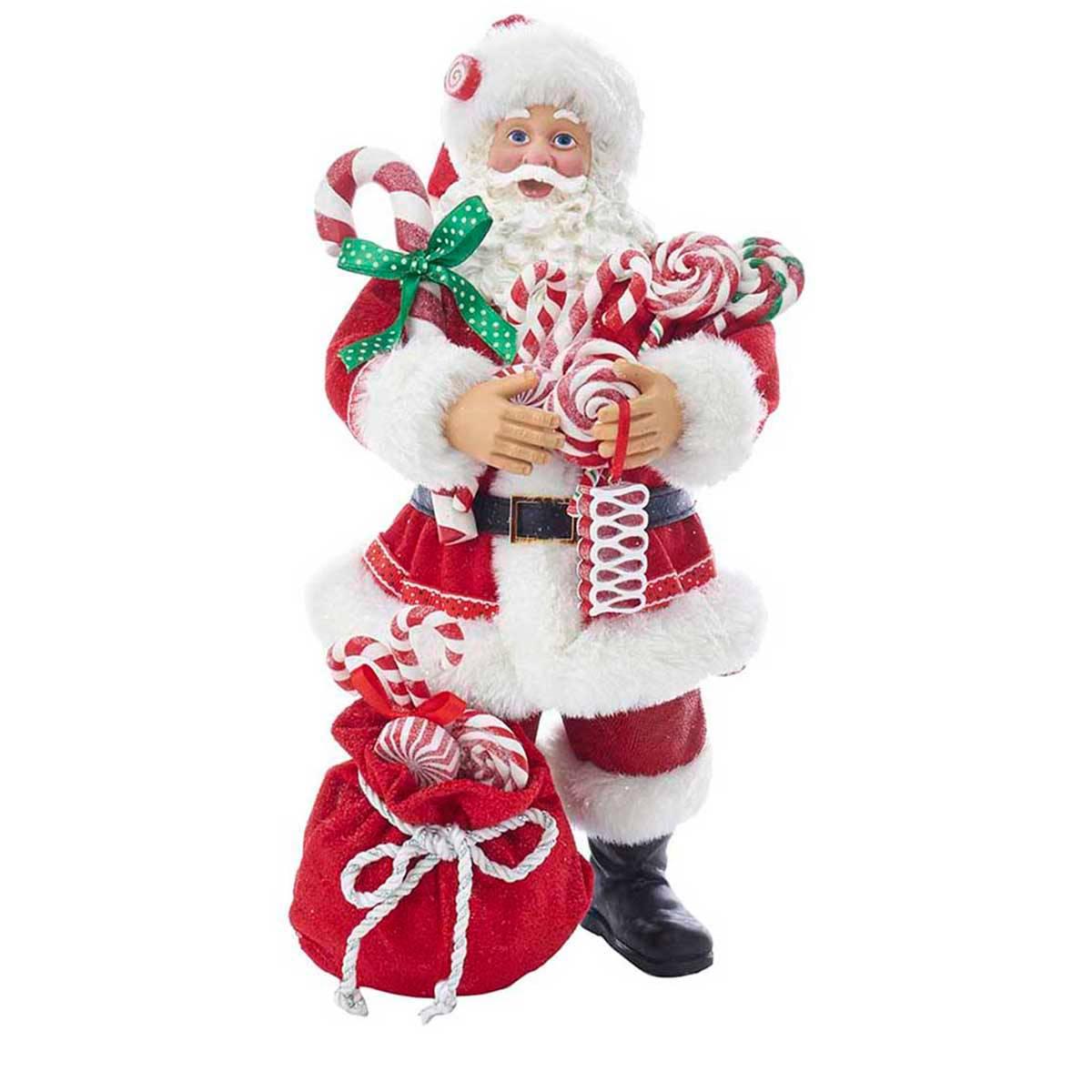 Click here for Kurt S. Adler 11in. Fabriche(tm) Santa with Christ... prices