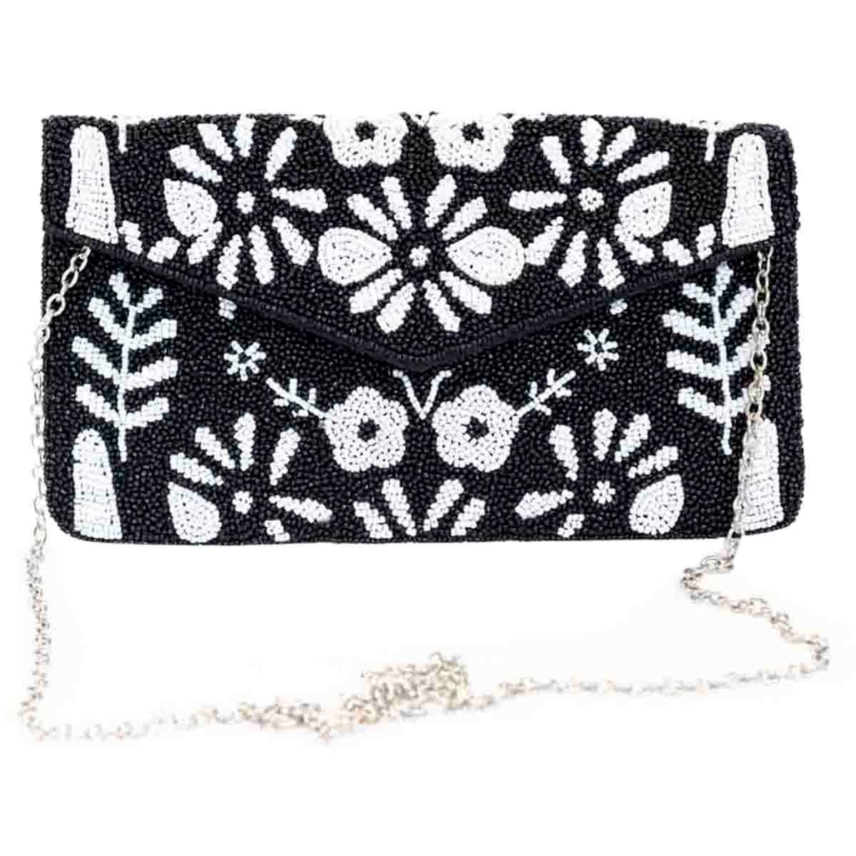 Click here for Sol & Mer Black/White Beaded Floral Envelope Clutc... prices