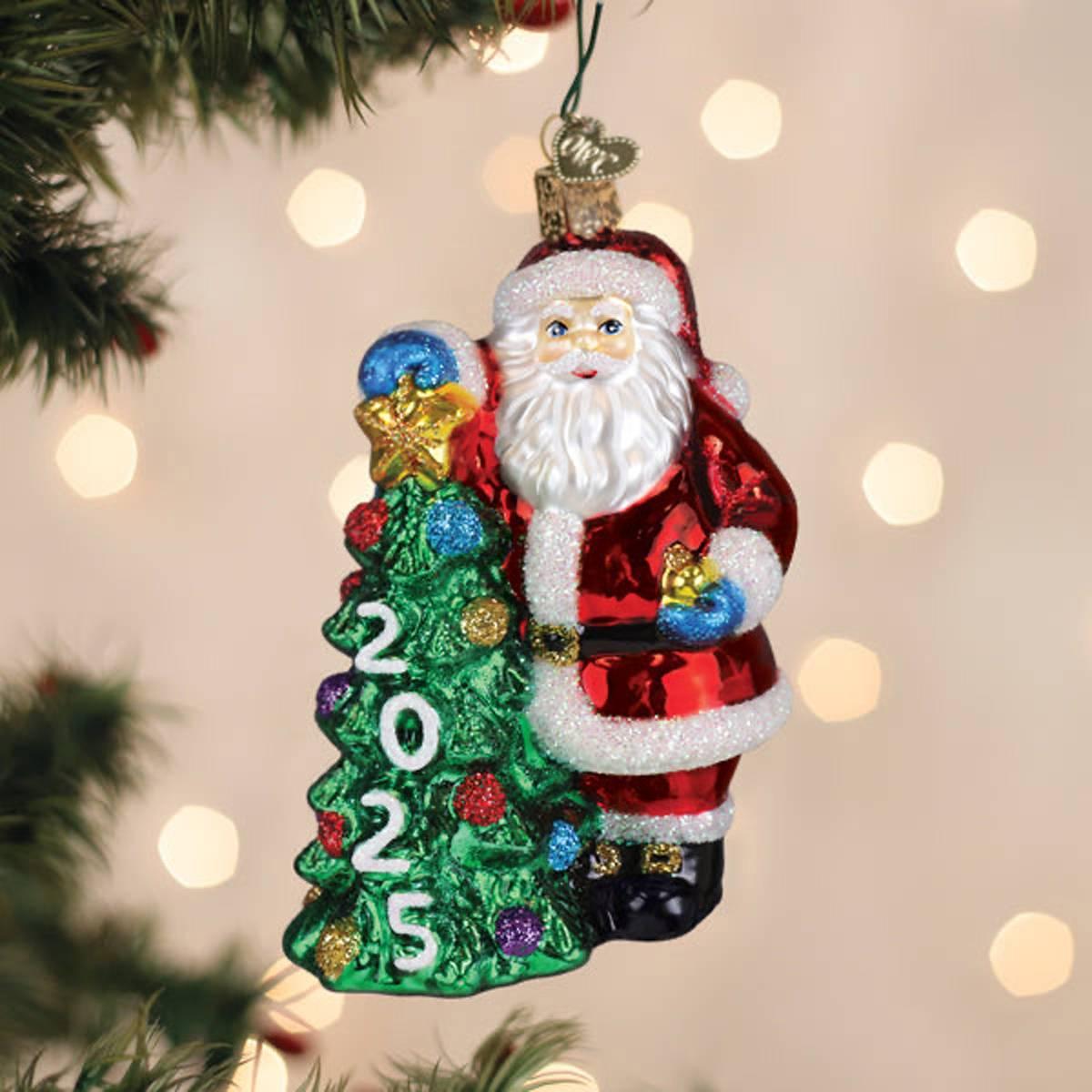 Click here for Old World Christmas 2025 Santa with Tree Blown Gla... prices