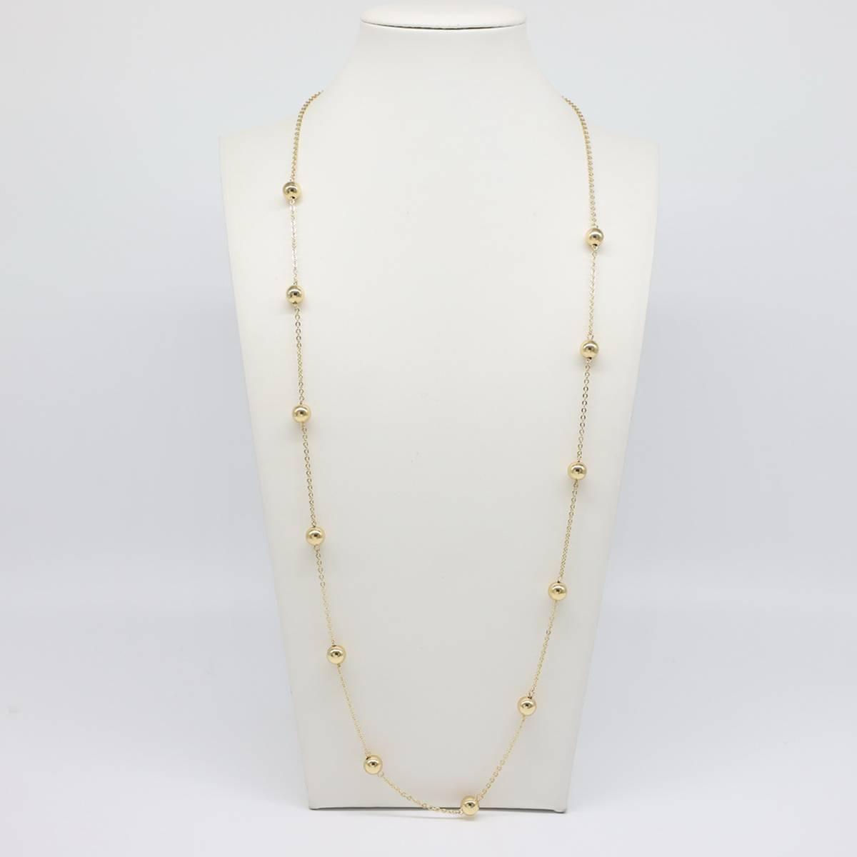 Click here for Design Collection Gold-Tone Long Ball Beaded Neckl... prices