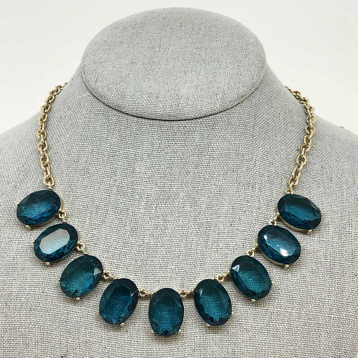 Click here for Ashley Cooper(tm) Teal Gemstone Princess Necklace prices